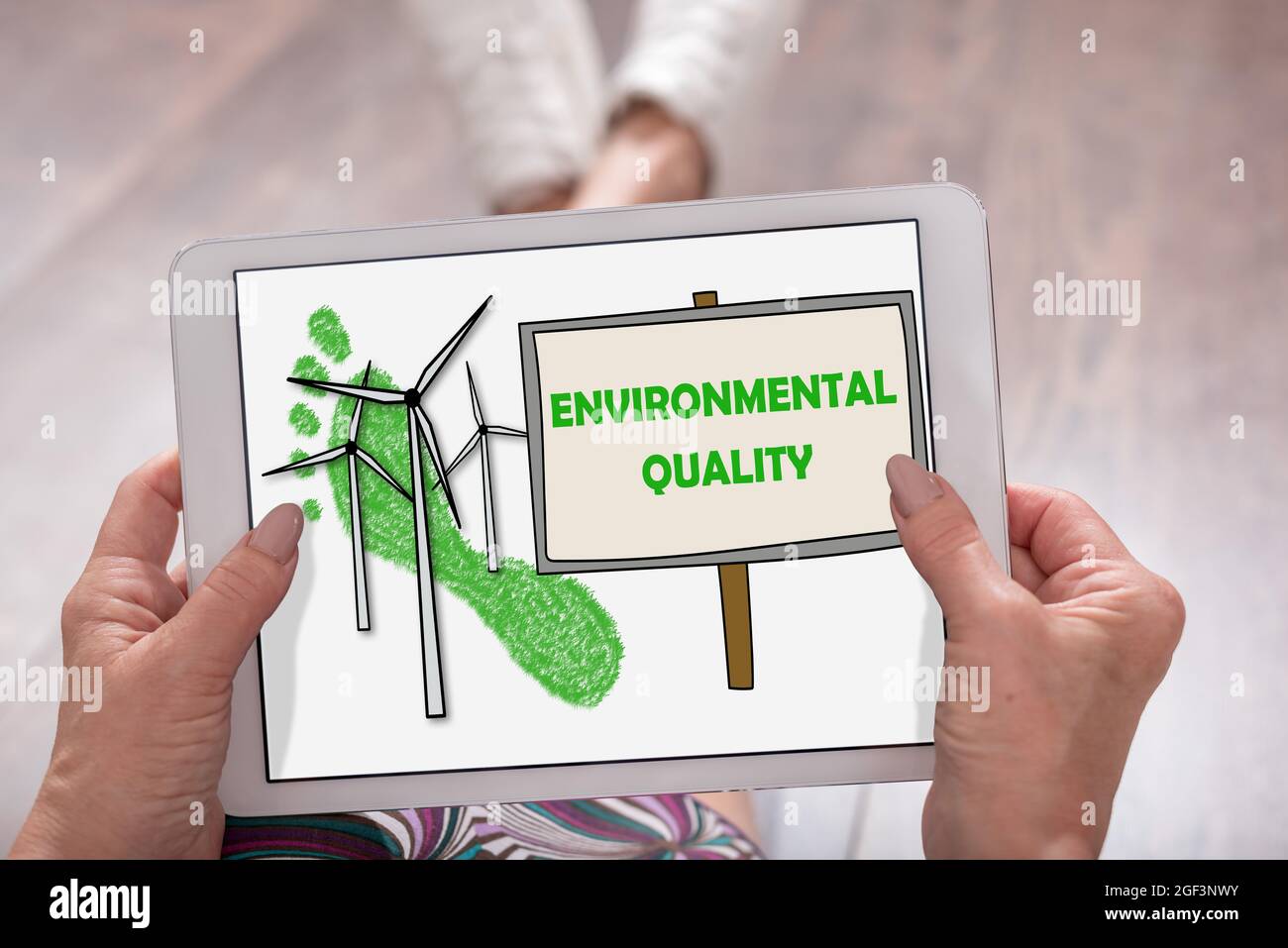 Environmental quality concept shown on a tablet held by a woman Stock ...