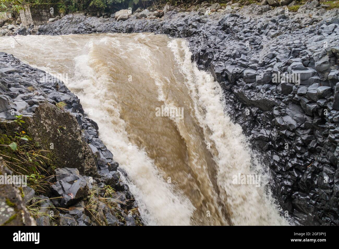 River entering Pailon del Diablo (Devil's Cauldron) waterfall near ...