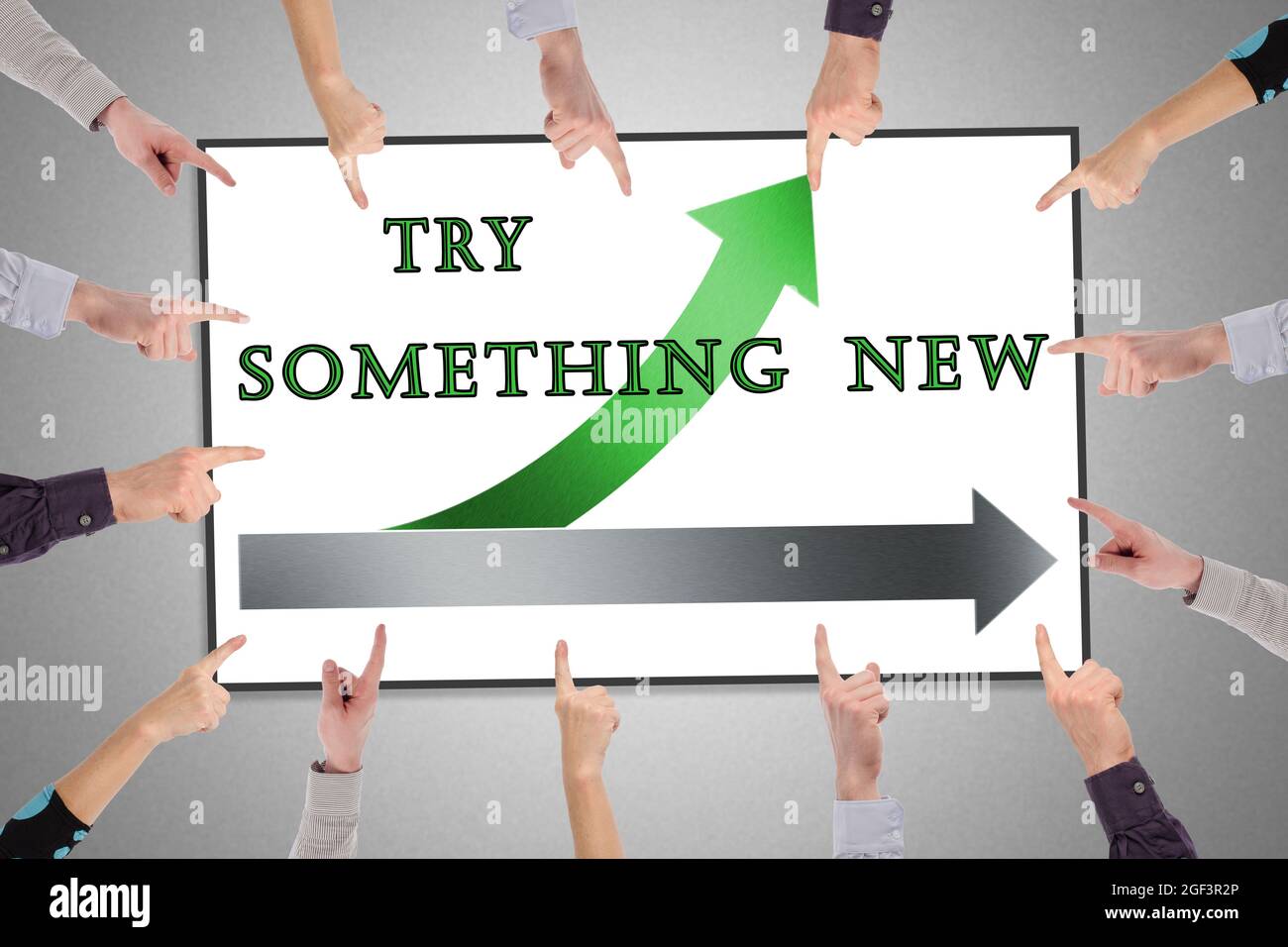 Hands pointing to try something new concept Stock Photo - Alamy