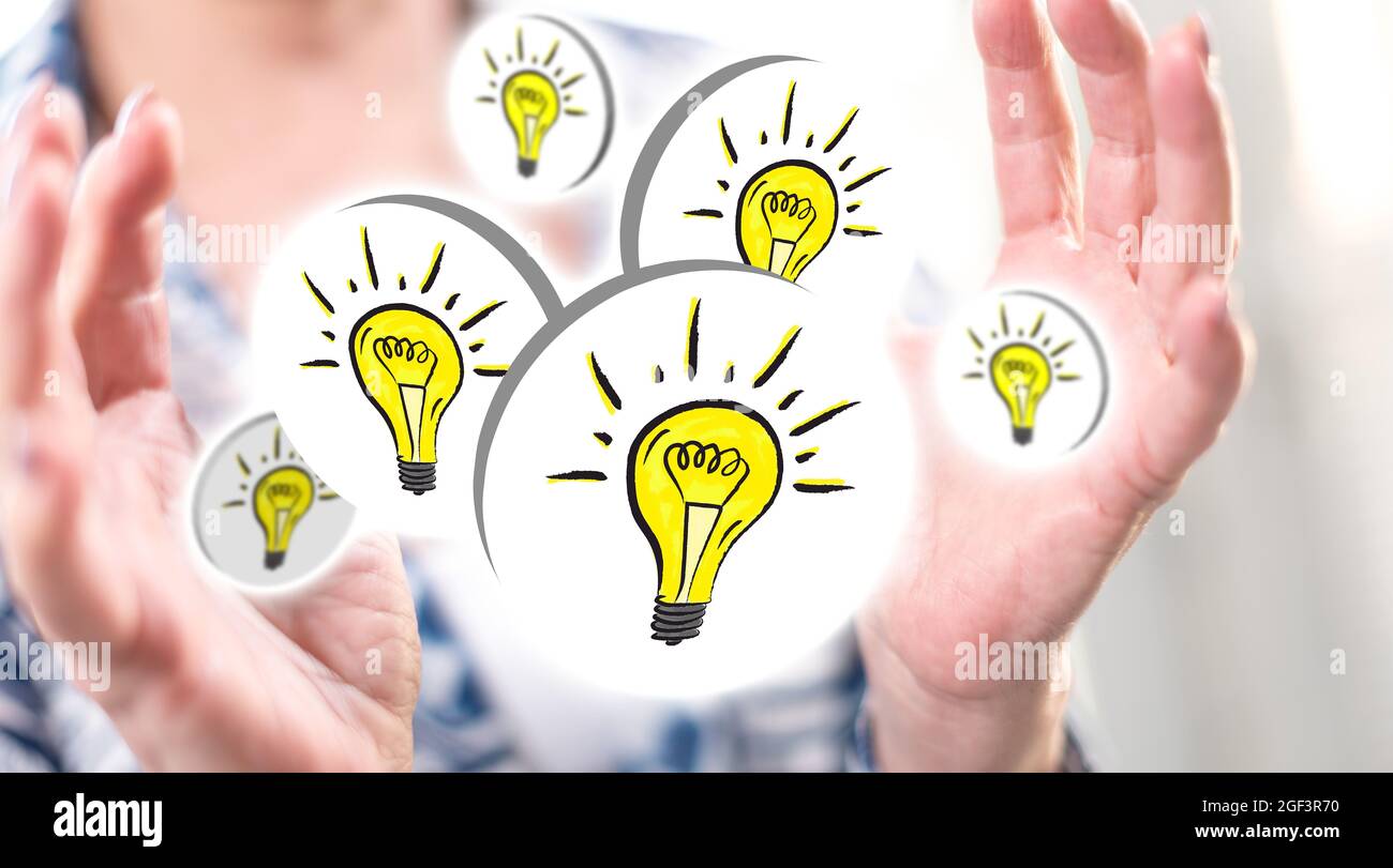 Innovation concept between hands hi-res stock photography and images ...