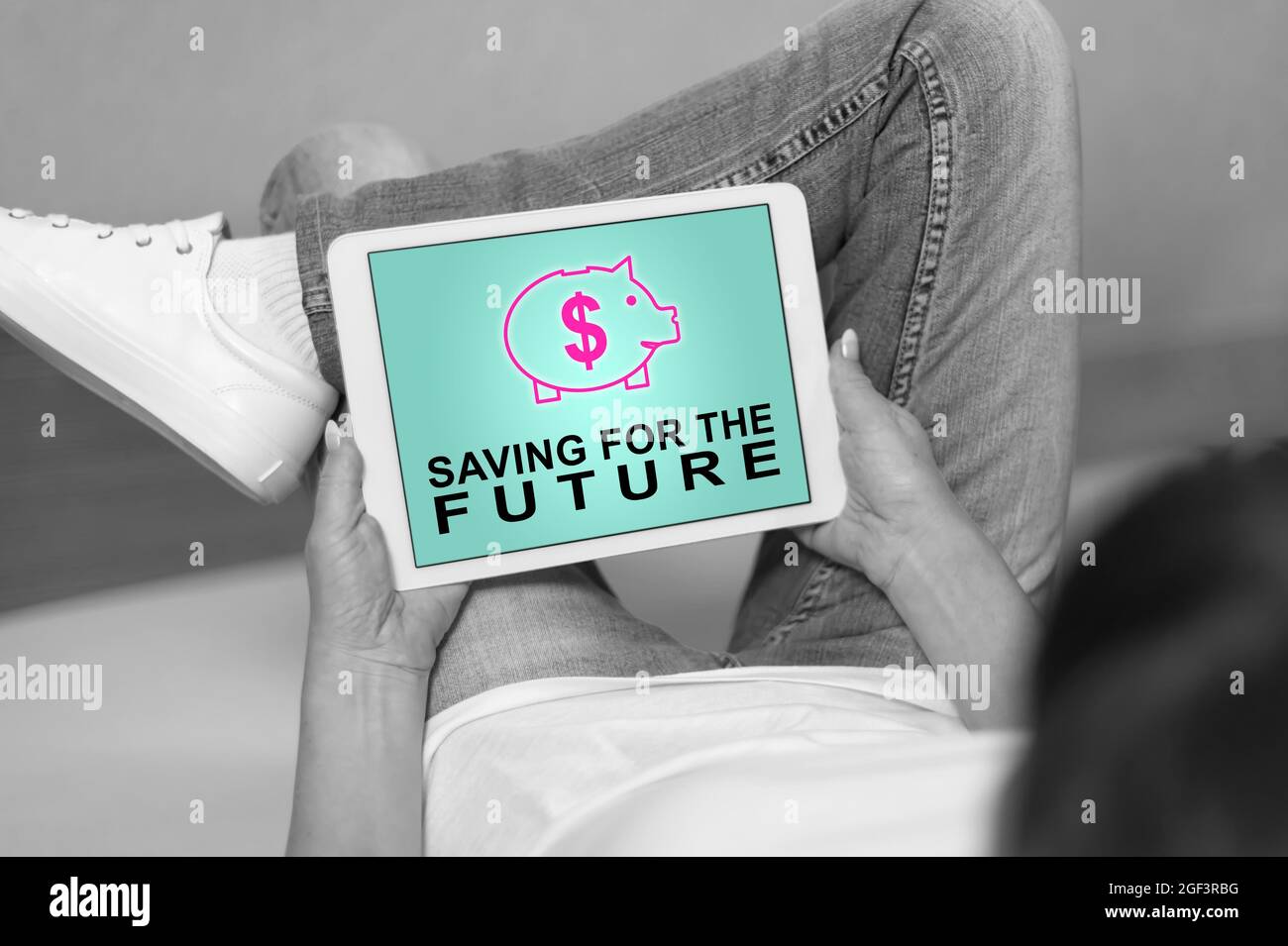 Woman looking at saving for the future concept on a tablet Stock Photo ...
