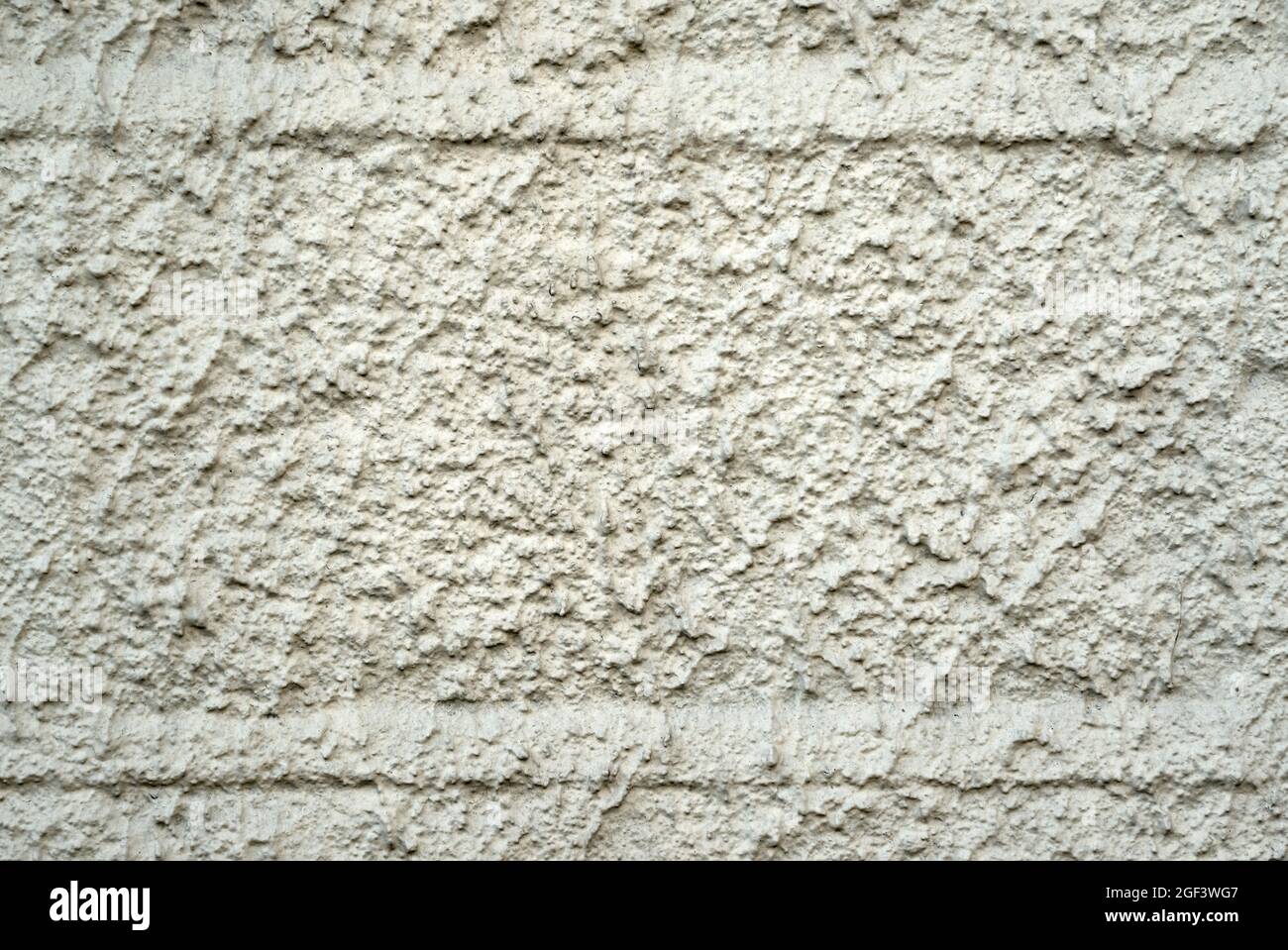 Closeup shot of a rough plastered wall texture used for wallpaper or ...