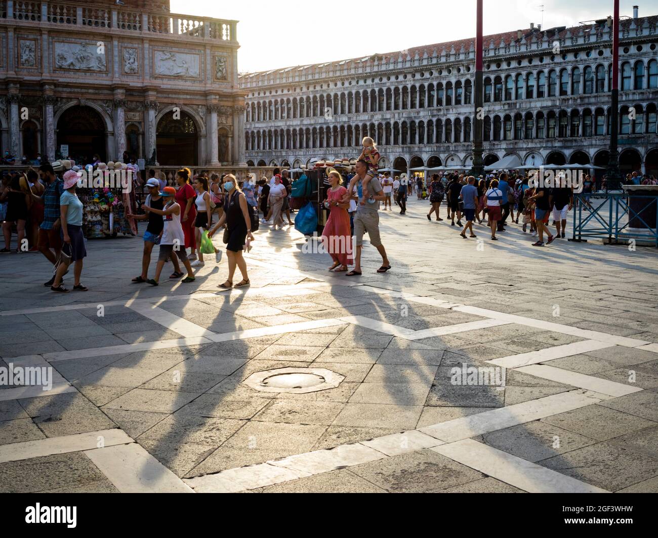 Tourists stroll along San Marco in August 2021 as travelling has become ...