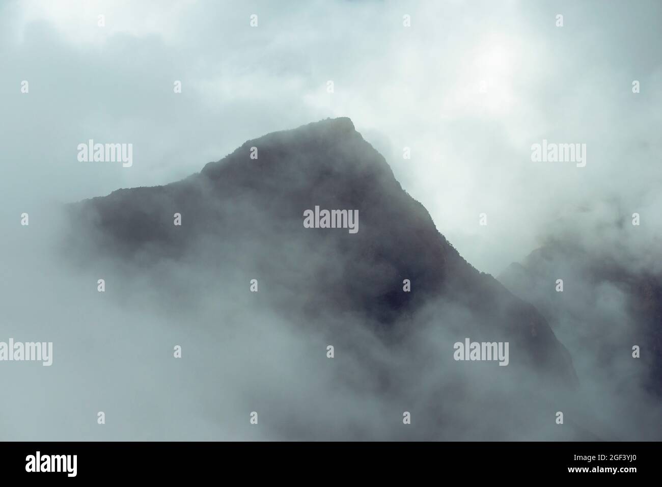 deep fog moving through mountain ridge in Peru Stock Photo - Alamy