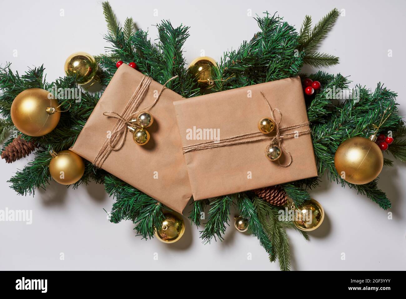 Branches of spruce tree with pine cones and Christmas toy decorations ...