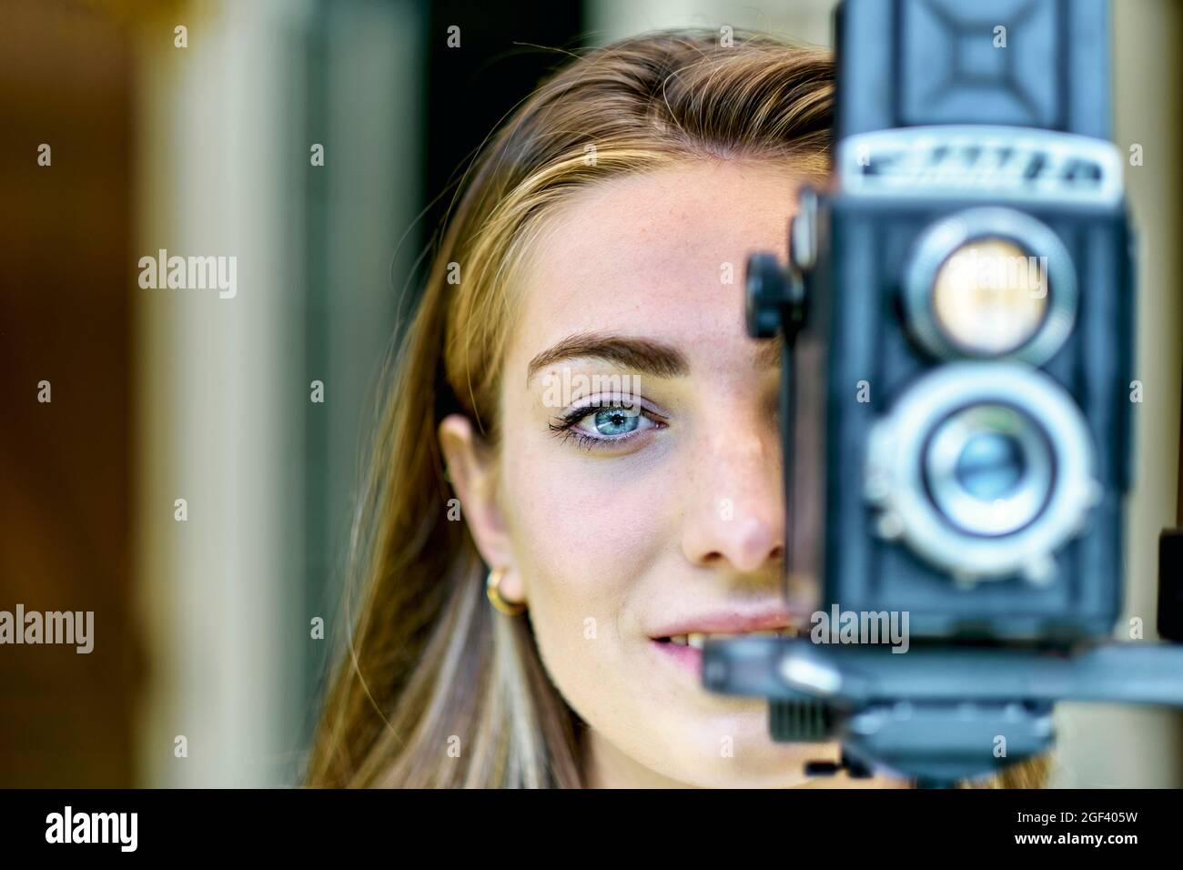 Portrait of a young beautiful caucasian woman in her 20´s with blue ...