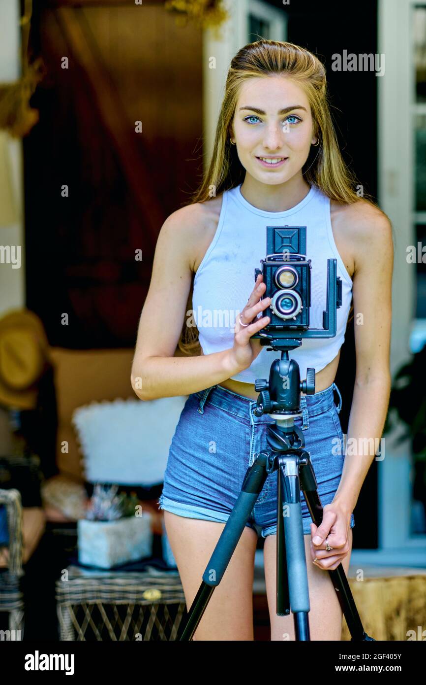 Portrait of a young beautiful caucasian woman in her 20´s with blue ...