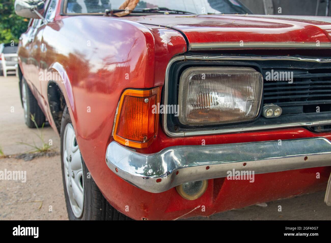 an old red Ford car on the side of the road Stock Photo - Alamy