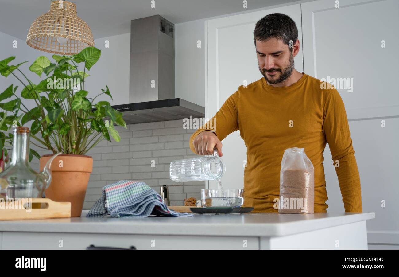 young man making bread Stock Photo - Alamy