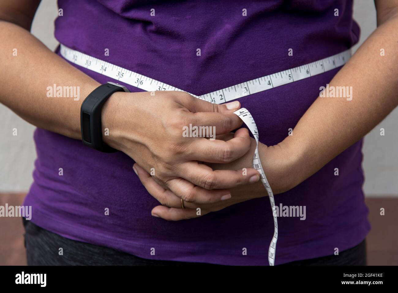 Overweight woman tape measure hi-res stock photography and images - Alamy