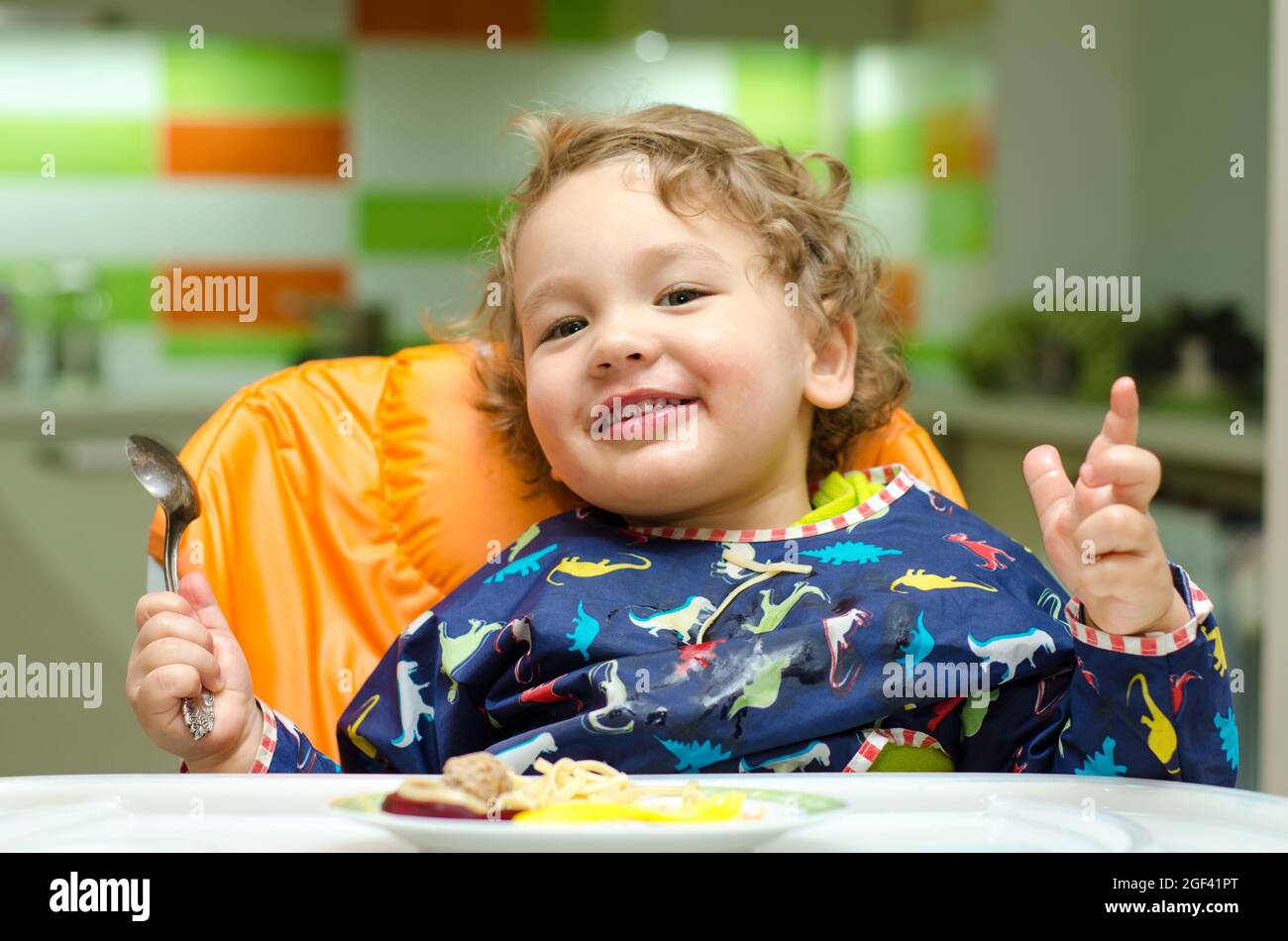little child eating at home Stock Photo - Alamy