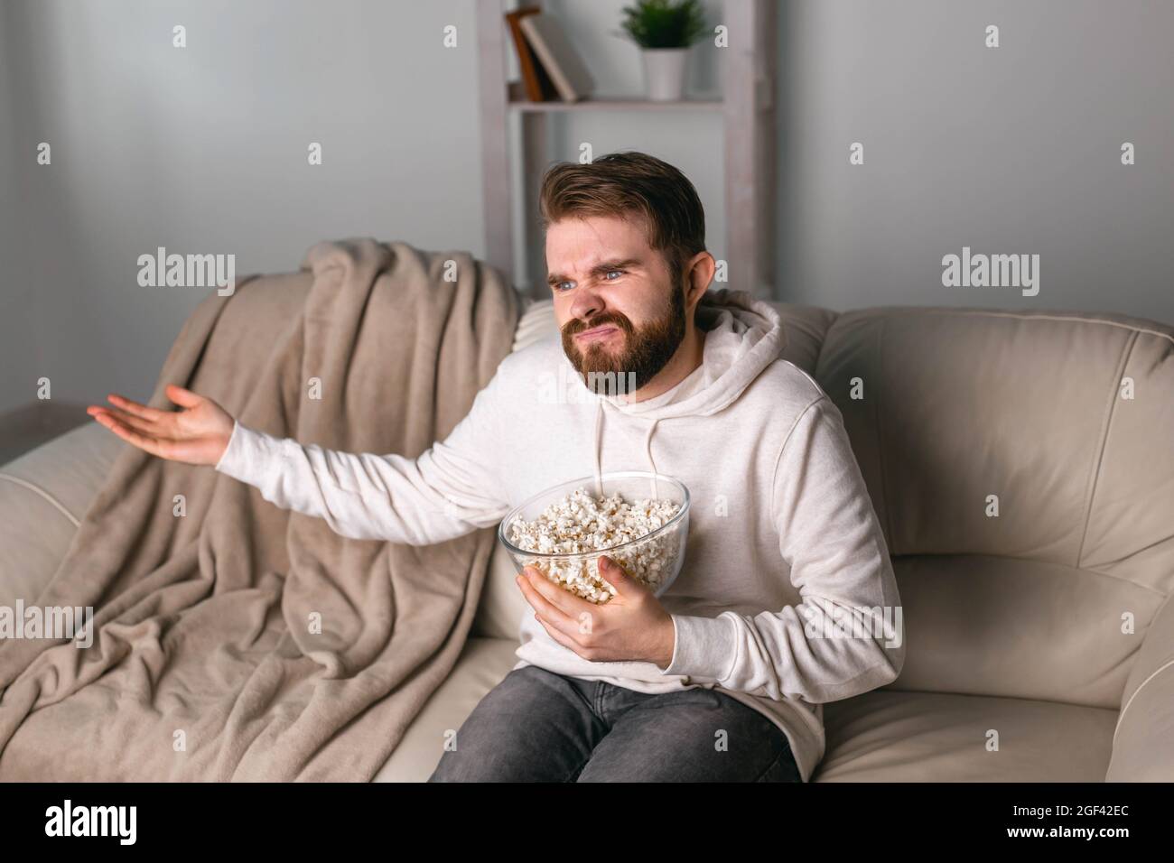 Depressed man watching tv hi-res stock photography and images - Alamy