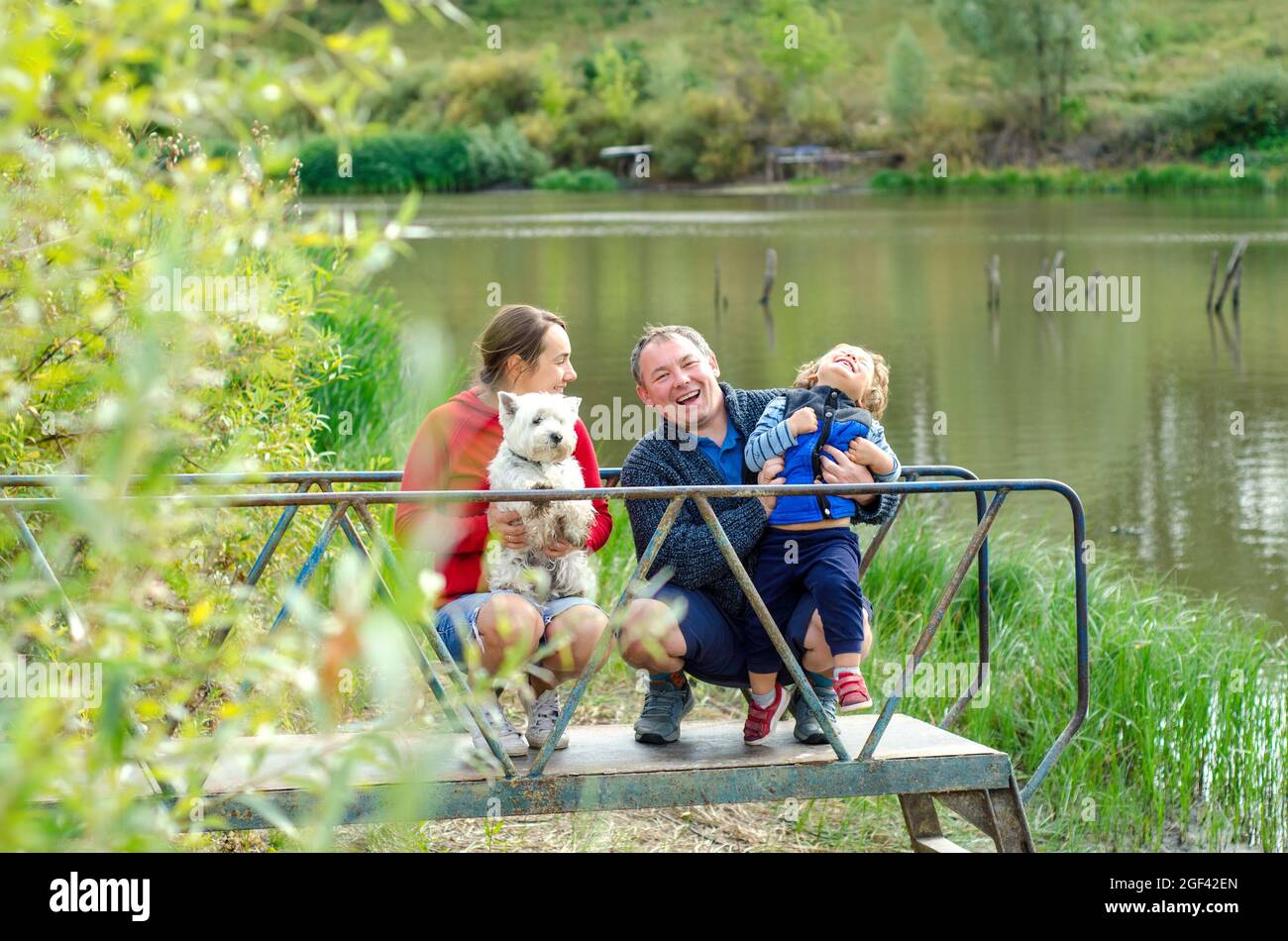 happy family enjoying weekend outdoors Stock Photo - Alamy