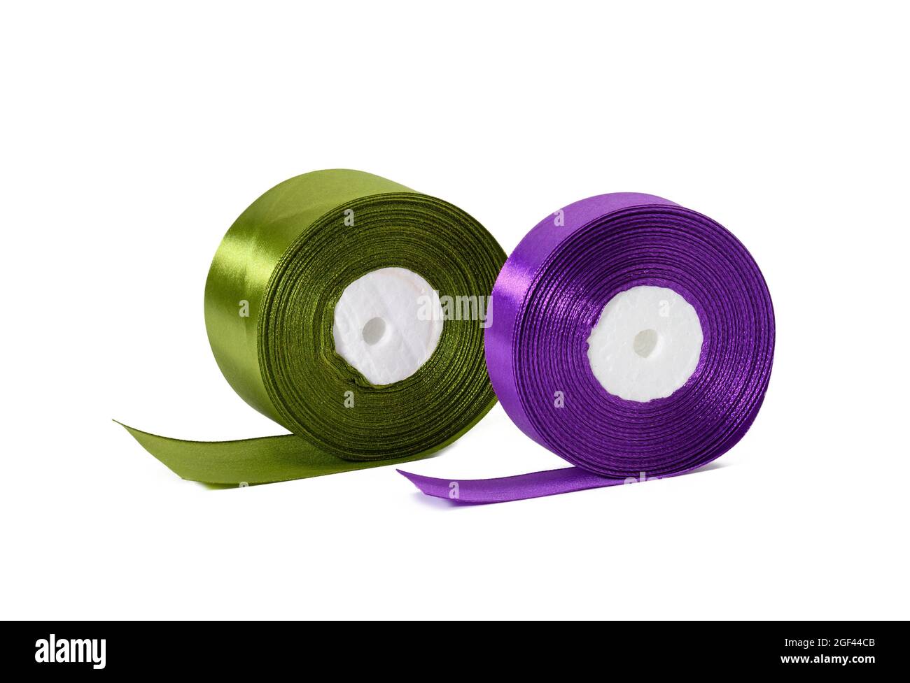 two rolls of silk green and purple ribbon, wrapping decor, white ...