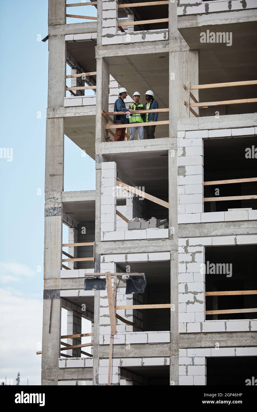 Vertical background image of high rise construction site, copy space ...