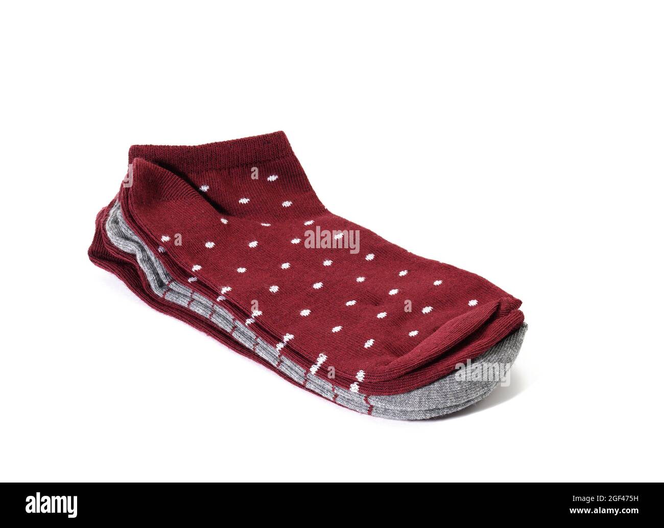 stack of burgundy and gray textile socks on white background Stock ...