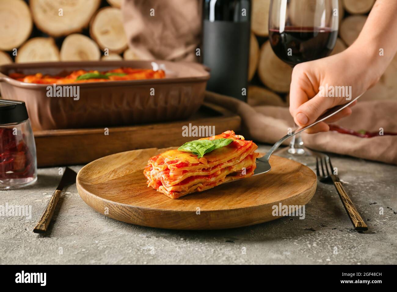 Person putting cheese on lasagna hi-res stock photography and images ...