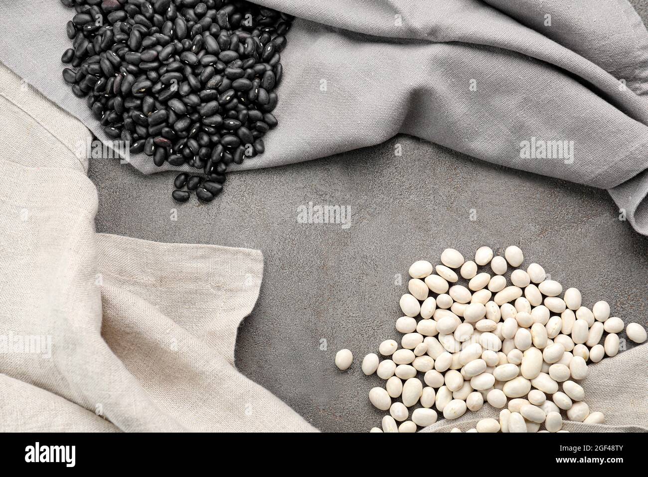 Heaps of raw beans on grey background Stock Photo - Alamy