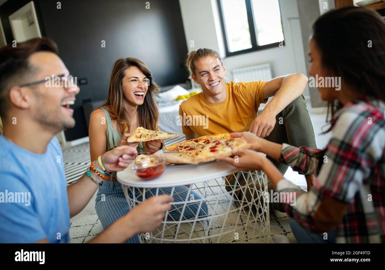 Spending time with friends. Group of cheerful young people talking and ...