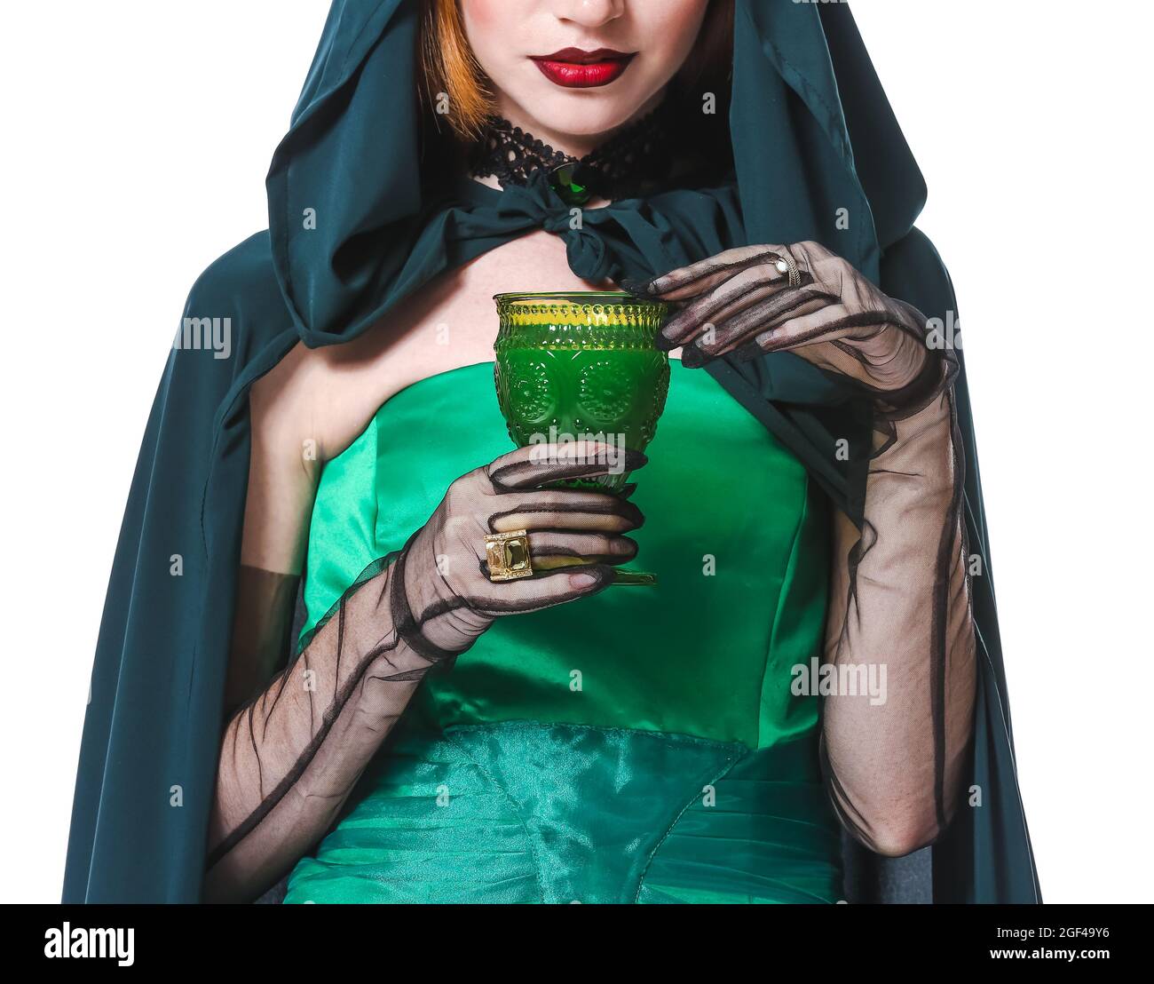 Young witch with potion on white background Stock Photo - Alamy