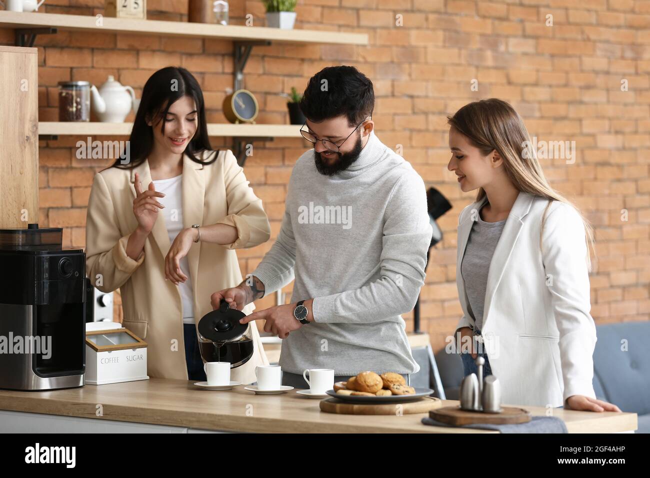 People having coffee break in office Stock Photo - Alamy