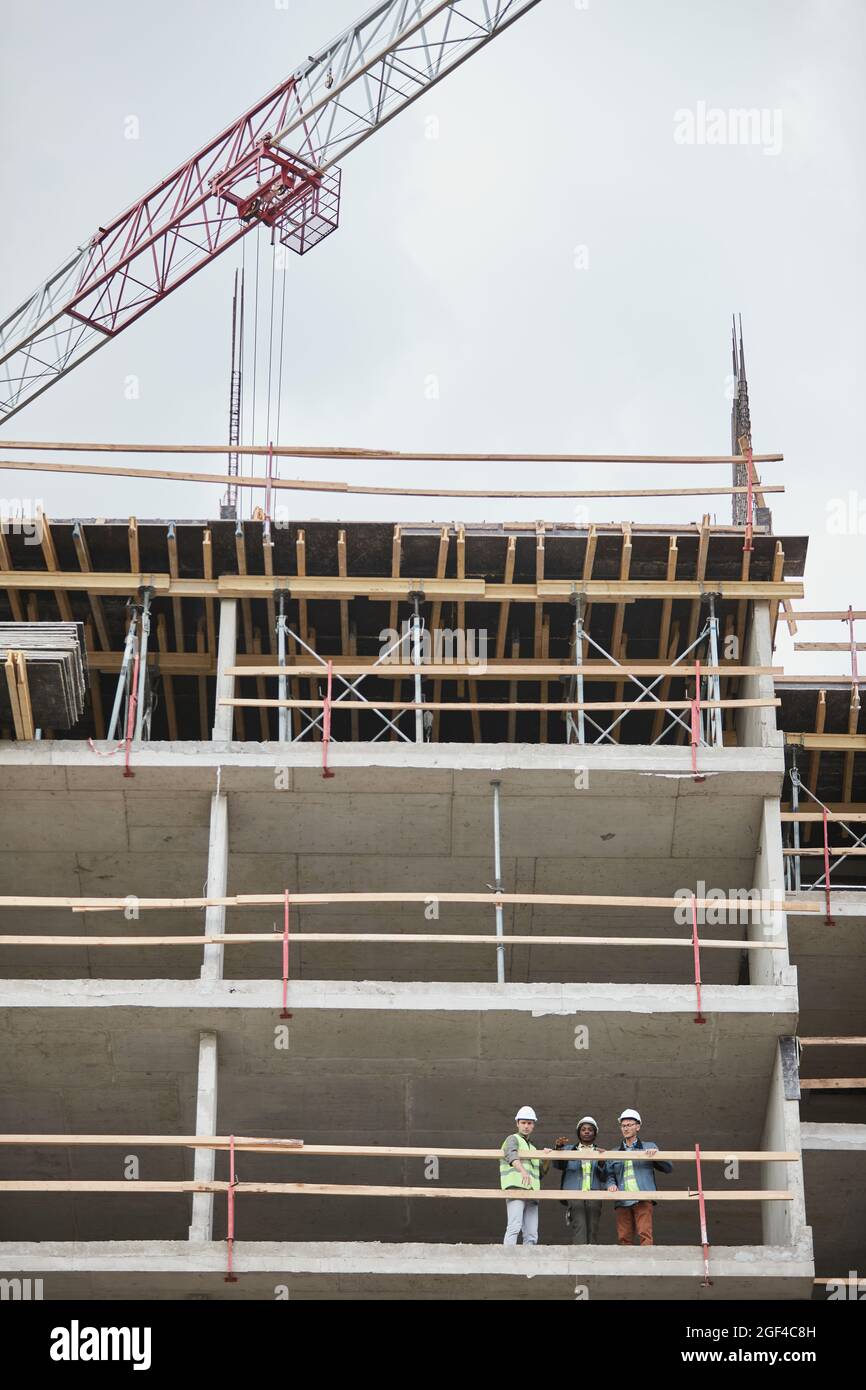 Vertical background shot of high rise construction site, copy space ...