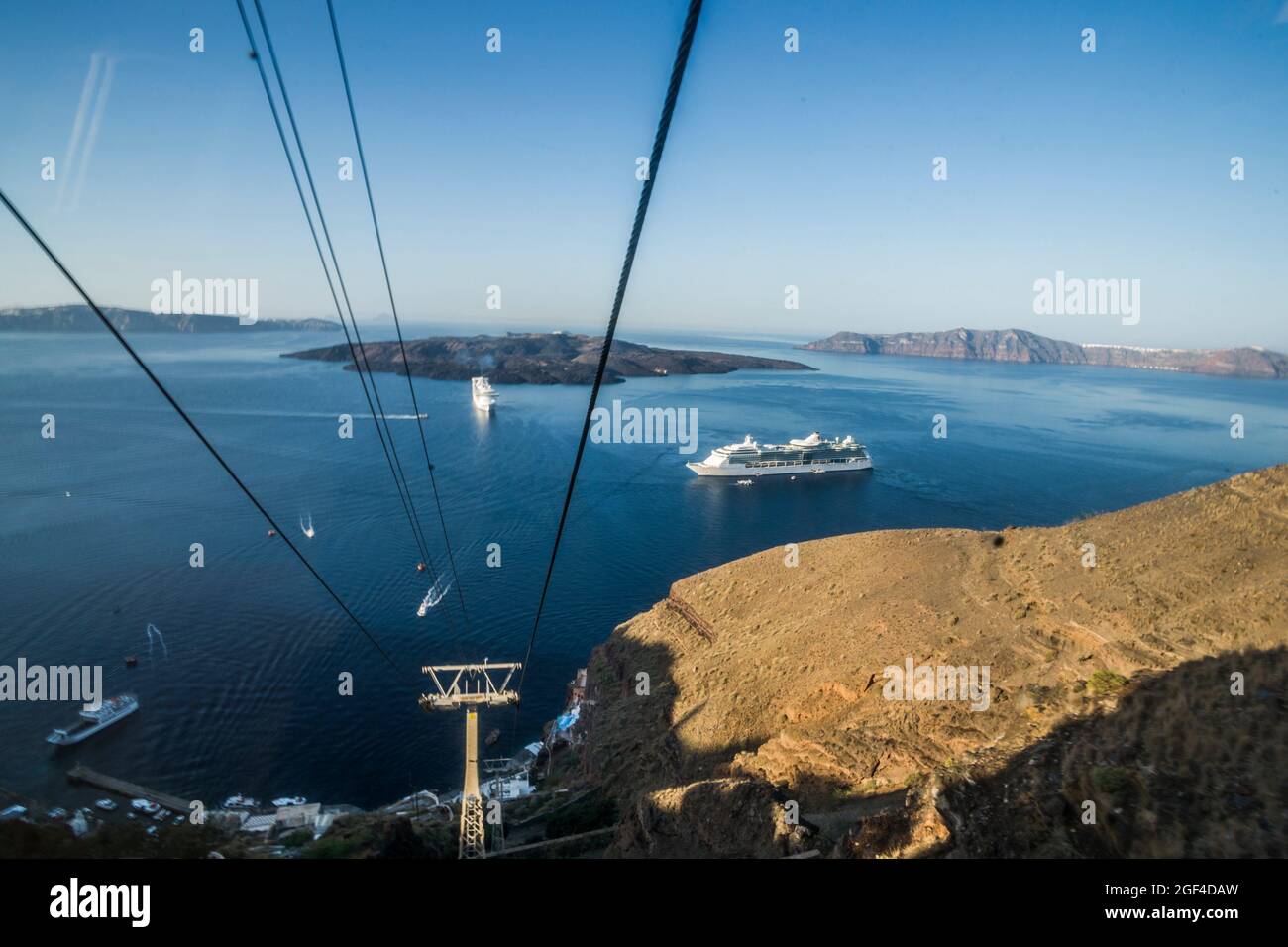 Cable car pylon. Cable car from Fira Port to Fira with Skala Port and ...