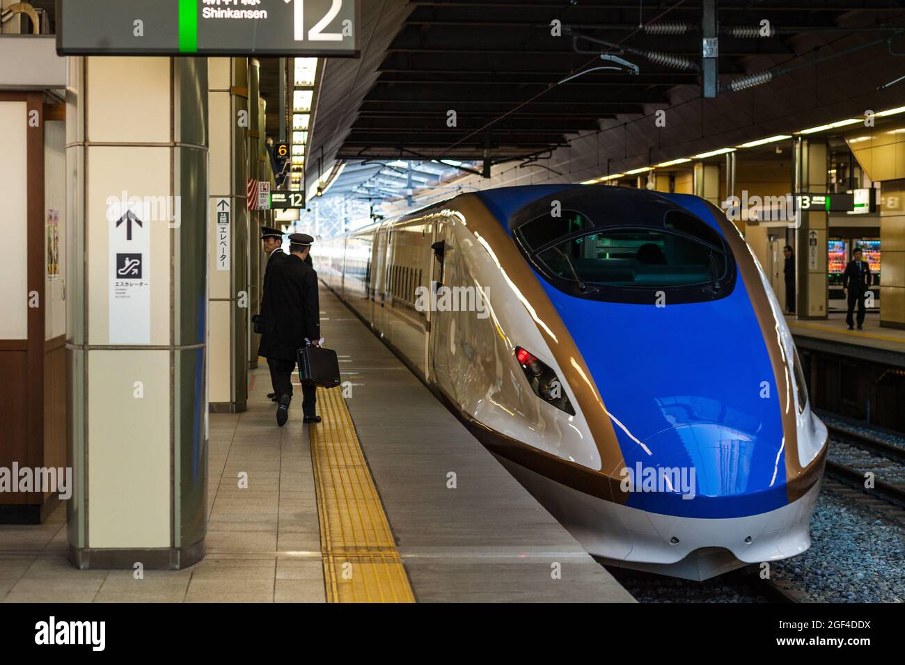 Japanese train drivers walking on the platform along the train Stock ...