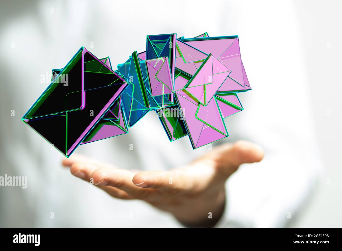 Man holding the virtual 3D message icons symbolizing electronic ...
