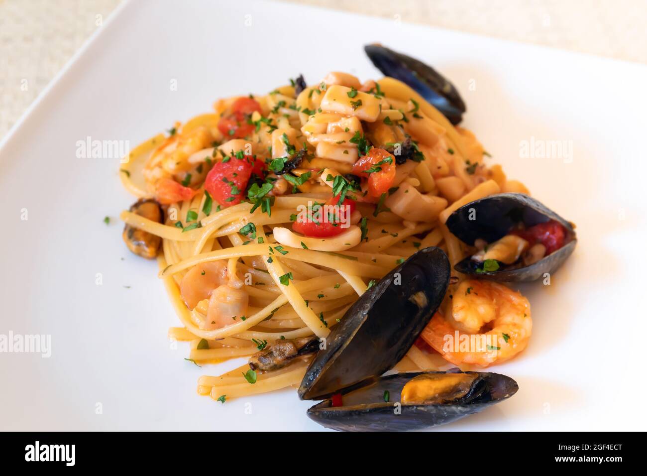 Linguine with seafood. Typical dish of Italian cuisine consisting of ...