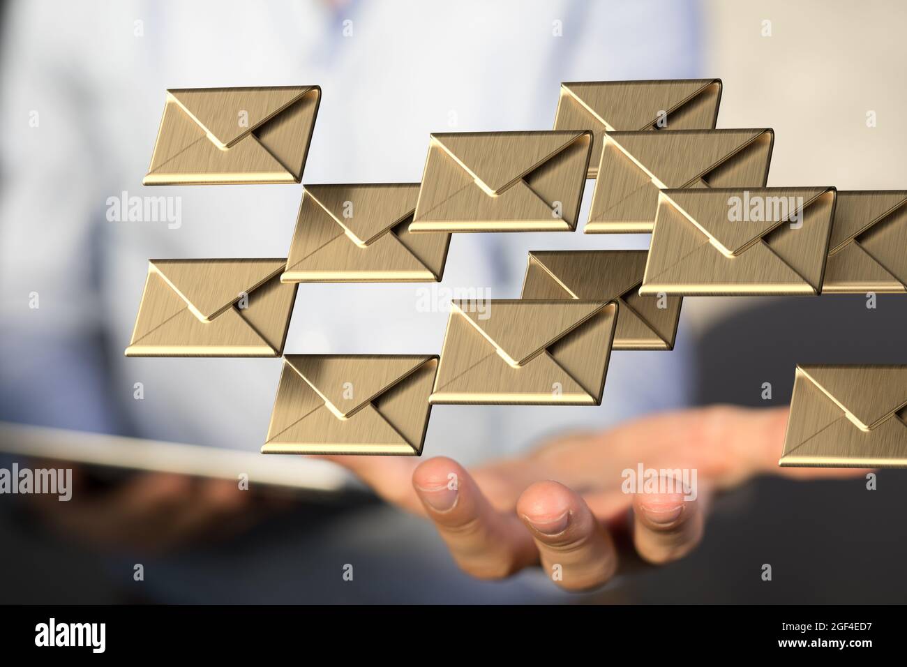 Man holding the virtual 3D message icons symbolizing online ...