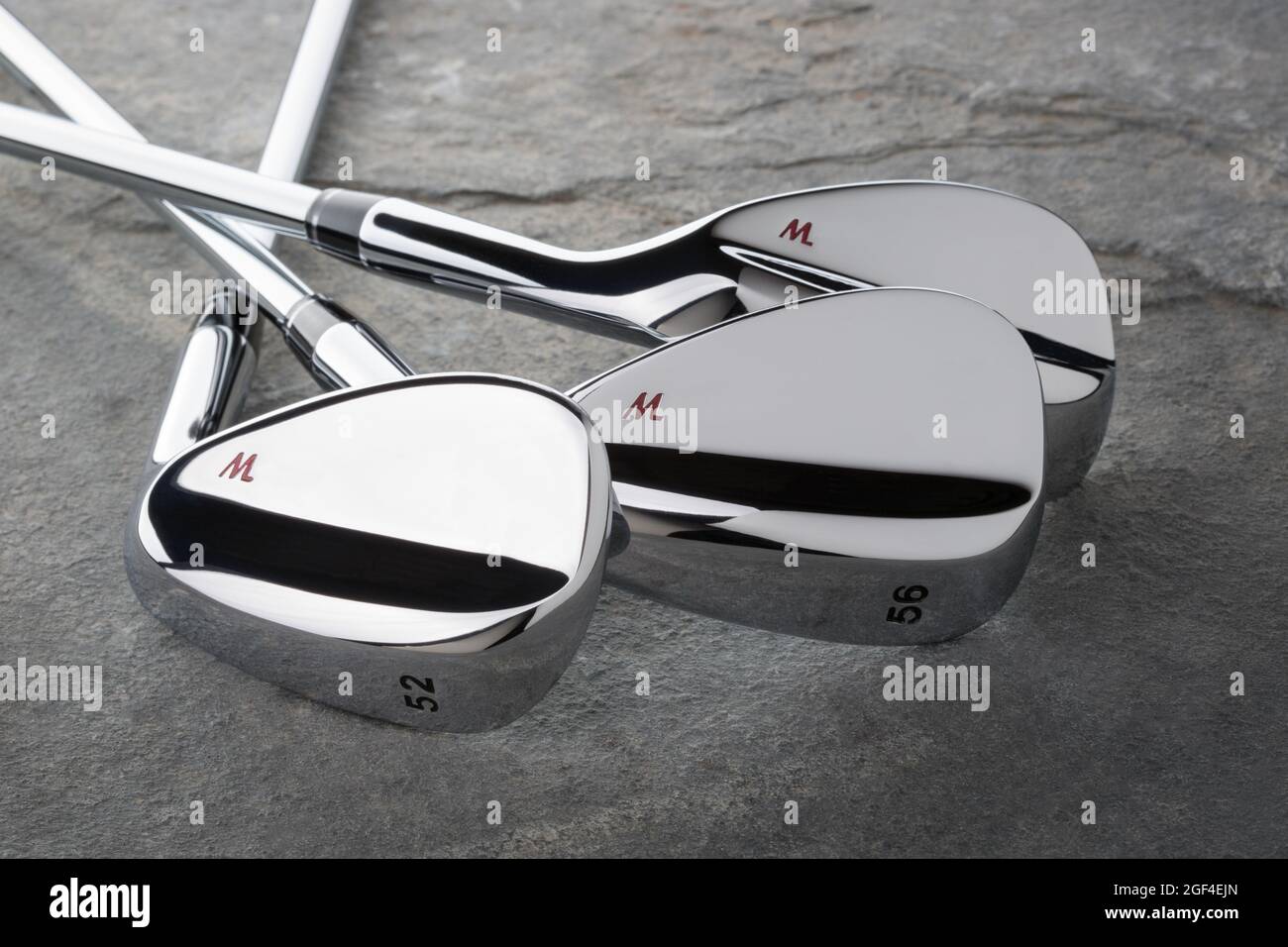 Chrome Golf Club Wedge Iron Set On Rock Surface Stock Photo - Alamy