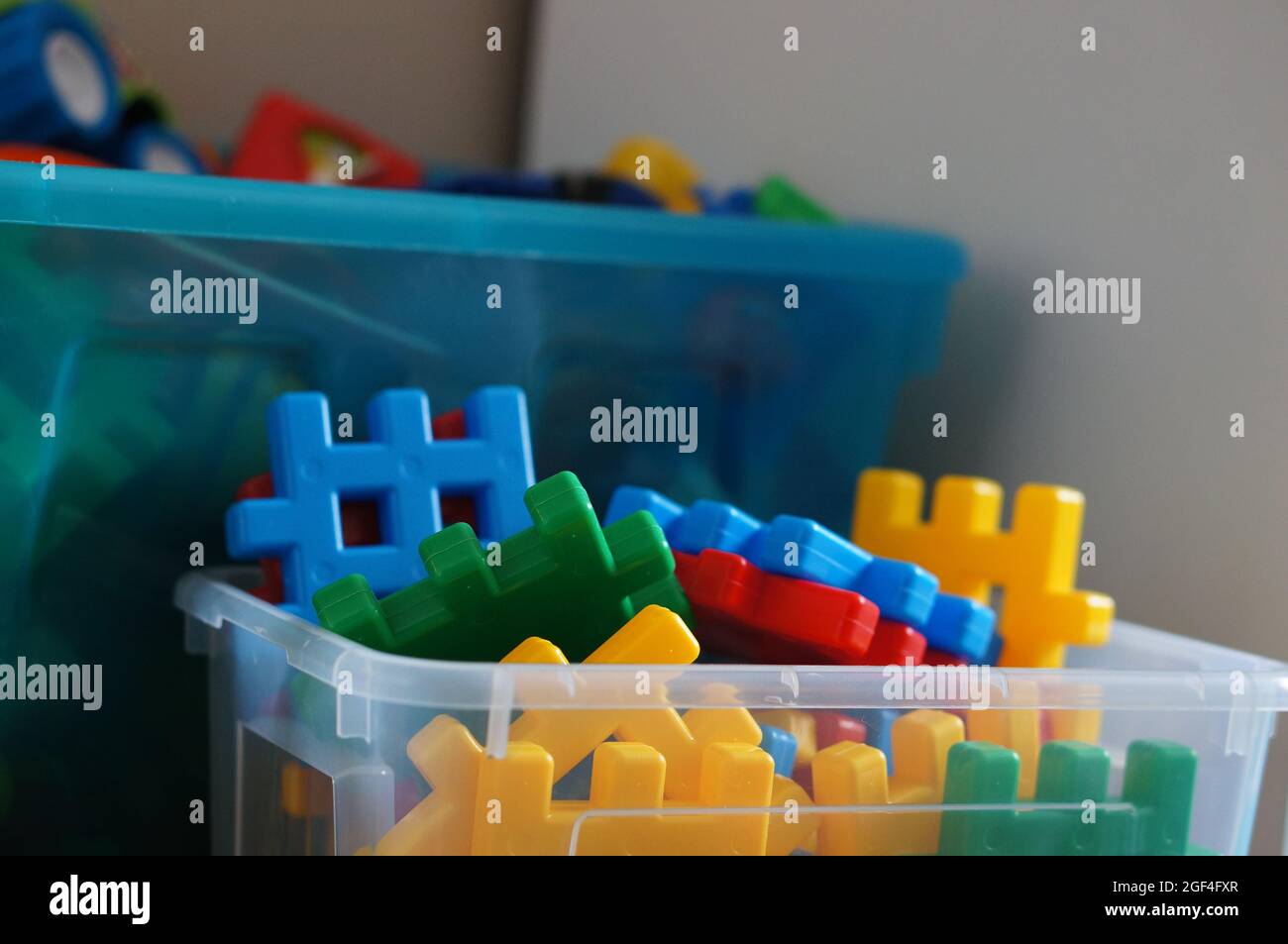 Parts of a toy constructor for children in a transparent bucket Stock ...
