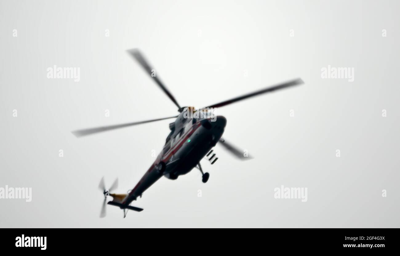 Rescue helicopter with a lowered ramp (safety ladder). Blurred ...