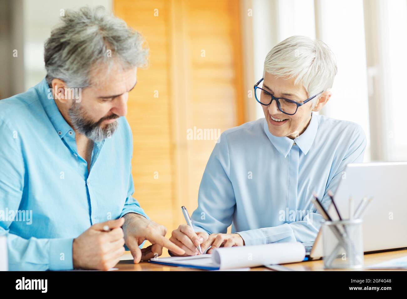 senior business people signing contract deal office business agreement ...