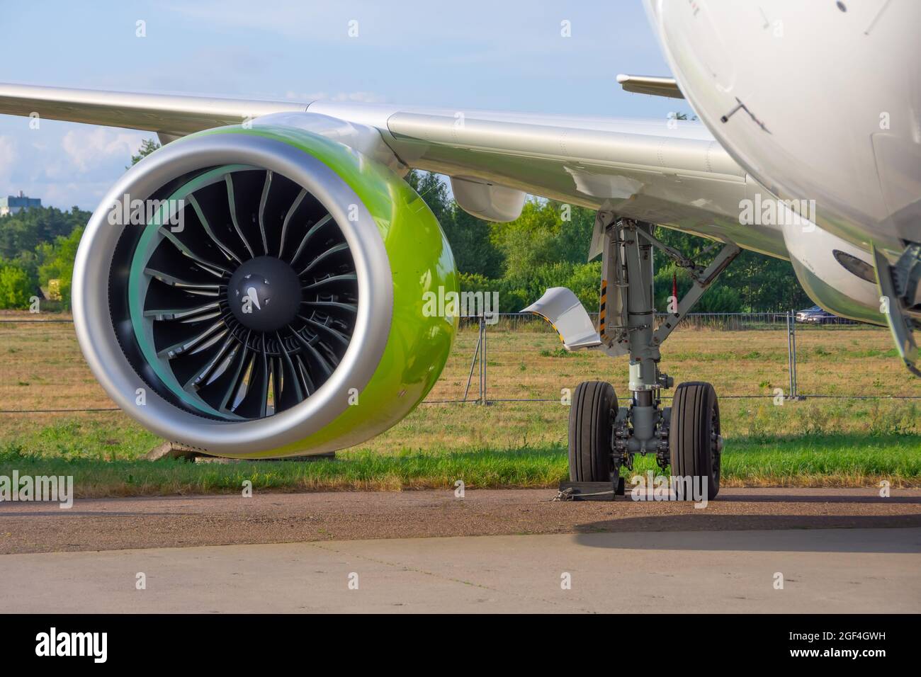 Airplane engine and landing gear under the wing of a passenger liner ...