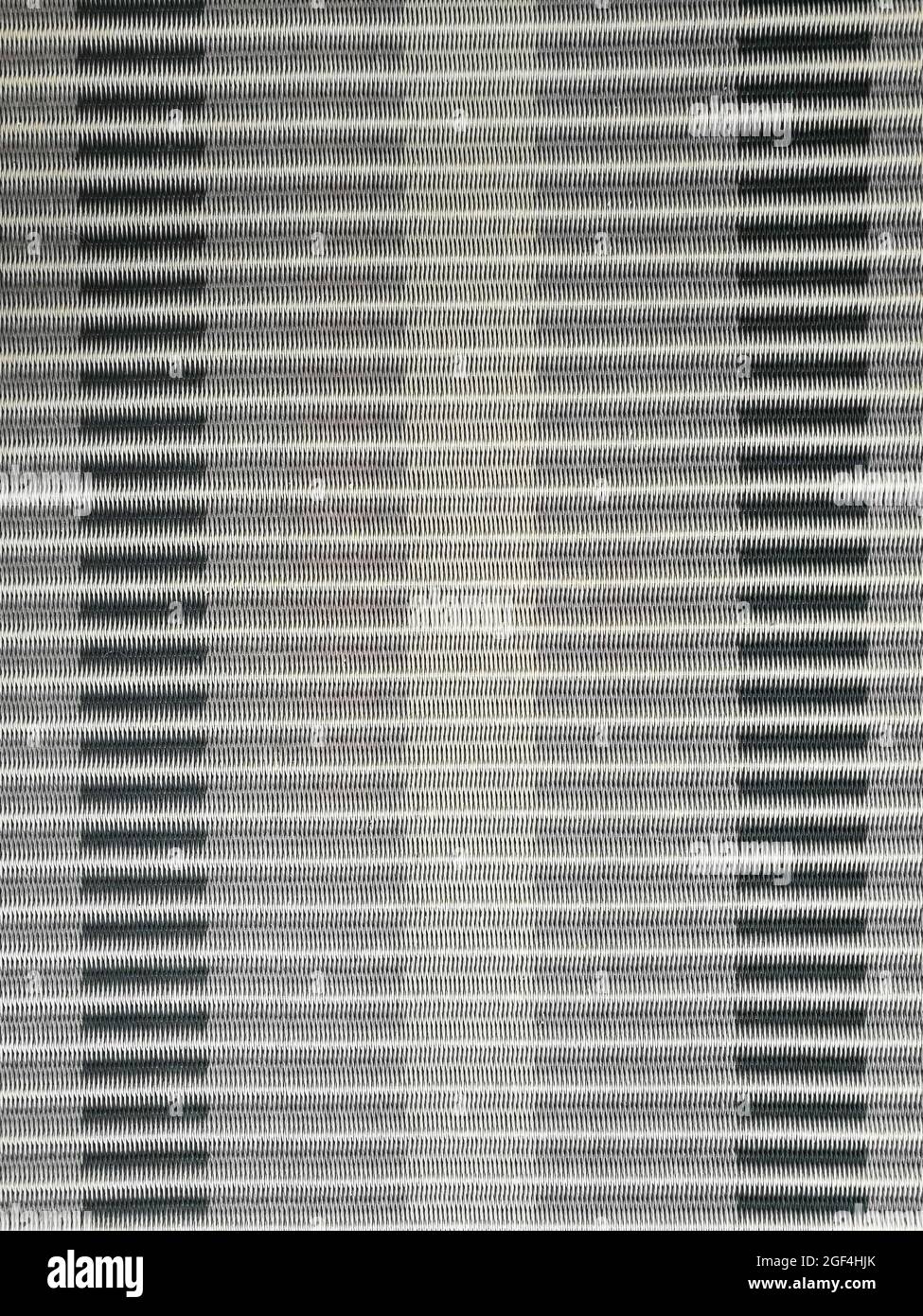 Texture of a rug with convex horizontal patterns in the gray and black ...