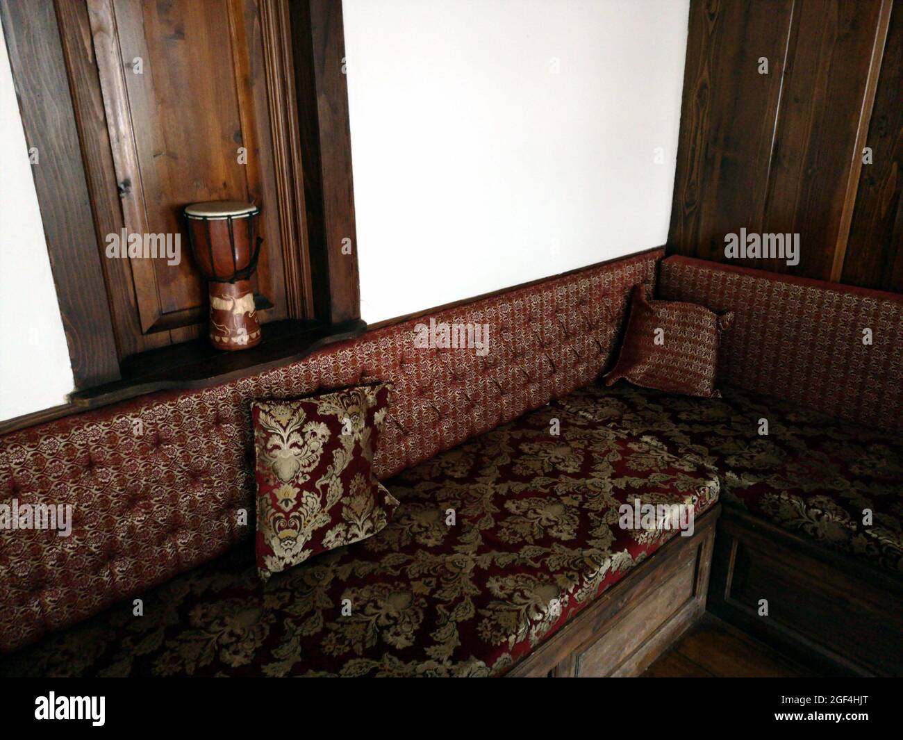 Old-style corner sofa with ornamented upholstery Stock Photo - Alamy