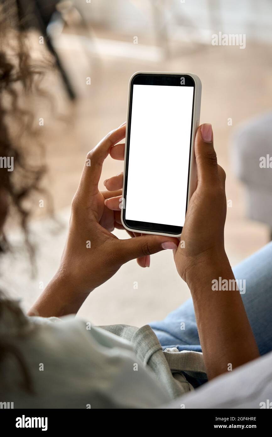 African American woman hand holding phone with mockup white blank ... African American woman hand holding phone with mockup white blank ...