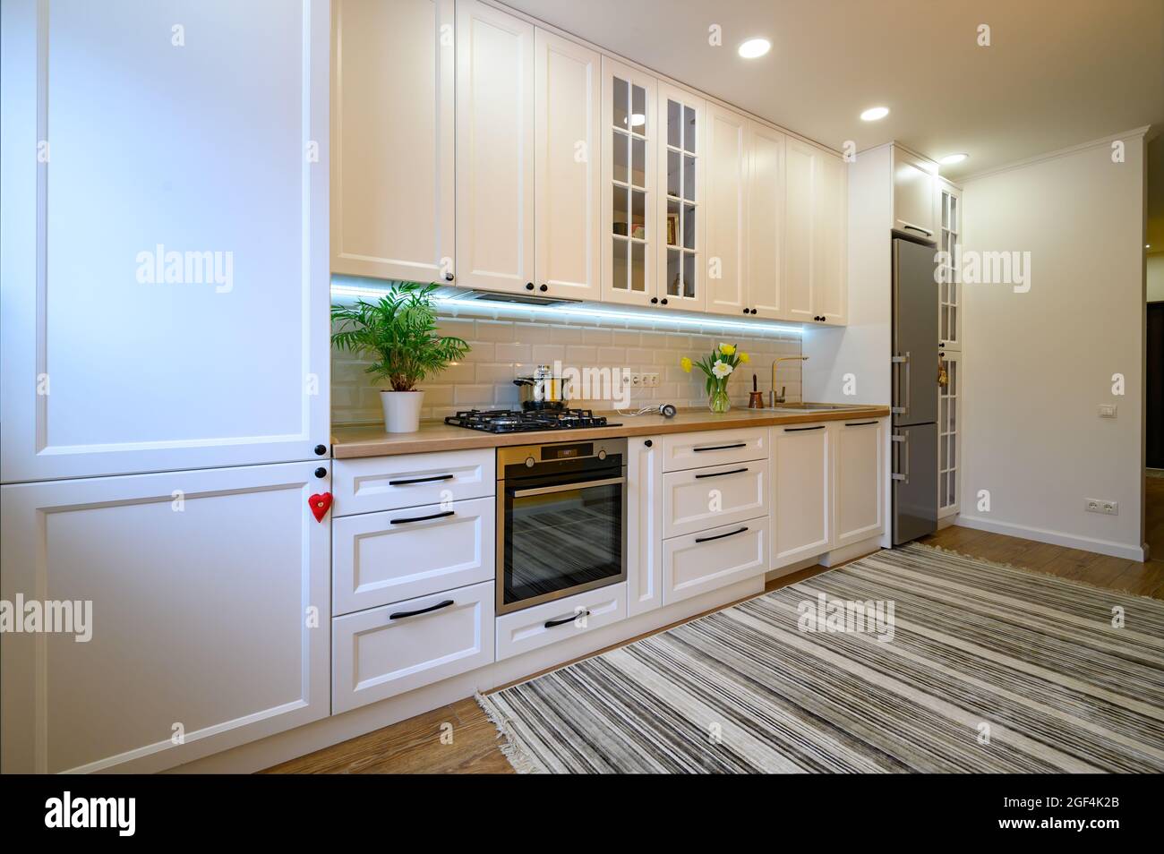 cozy modern well designed kitchen interior Stock Photo - Alamy