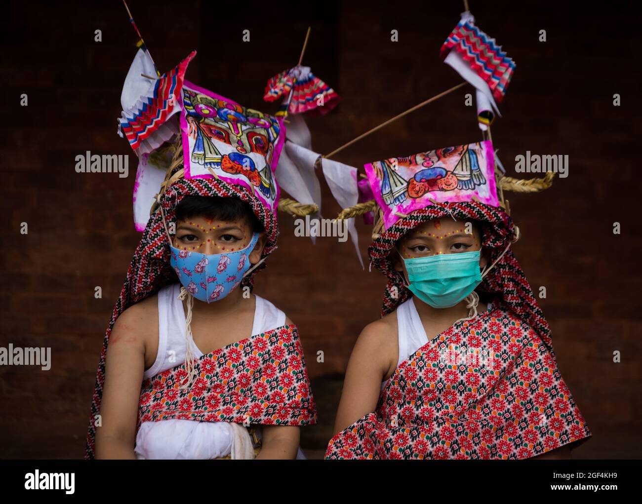 Children dressed in traditional costumes take part in the festival ...