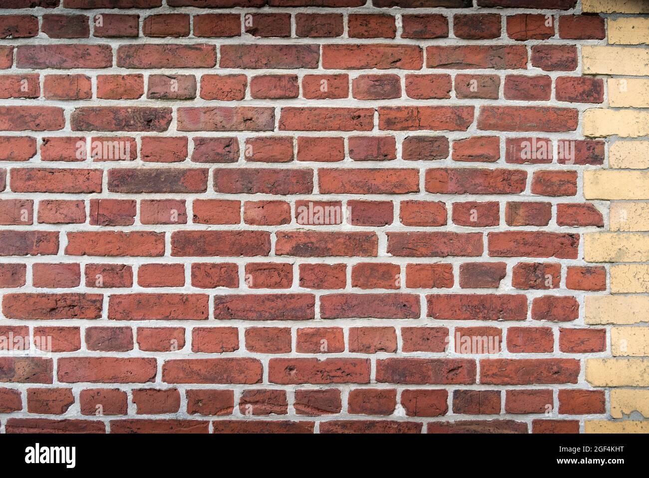 Red brick wall with yellow border and without people Stock Photo - Alamy