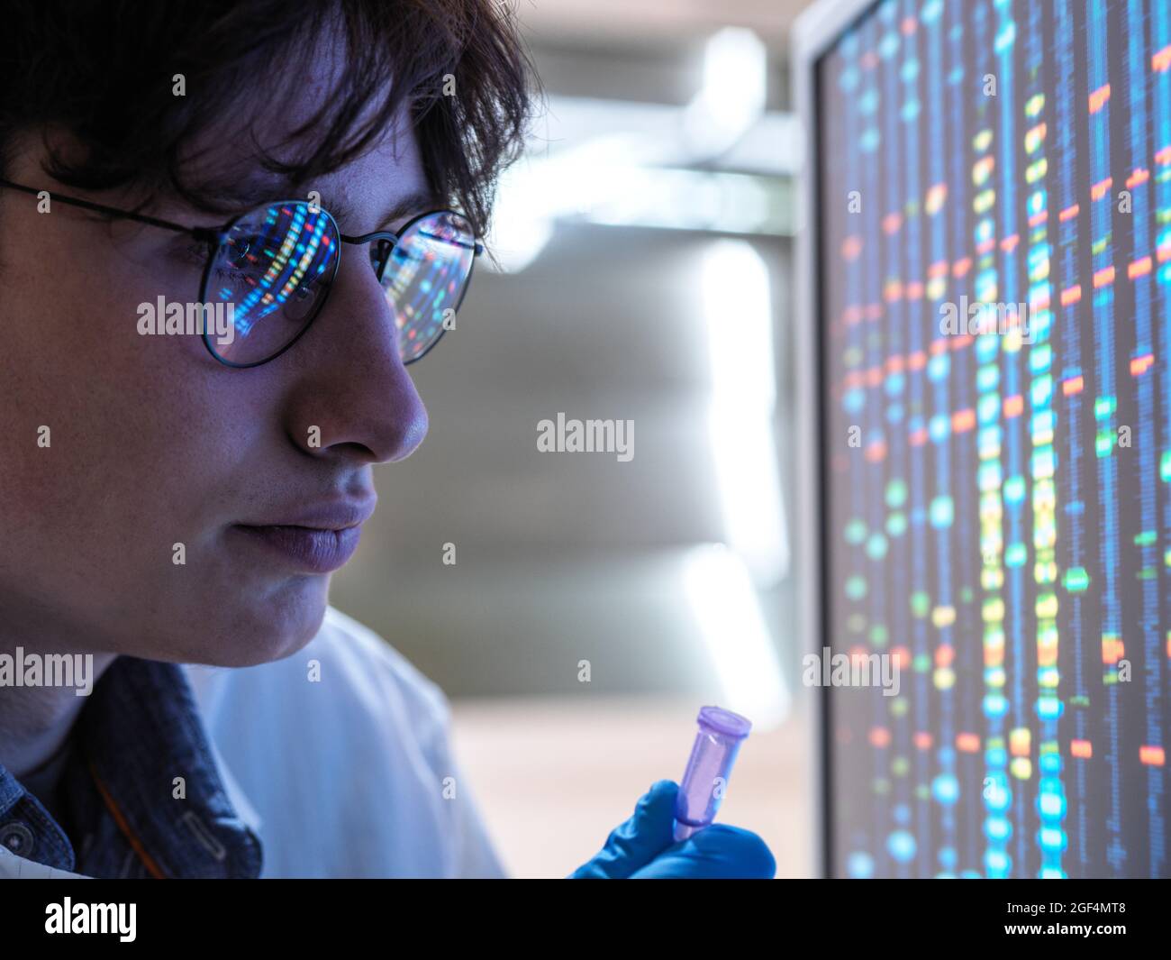Male scientist checking DNA on computer at laboratory Stock Photo - Alamy