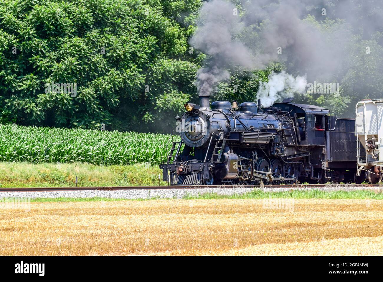 View of an Antique Restored Steam Passenger Train Blowing Smoke and ...