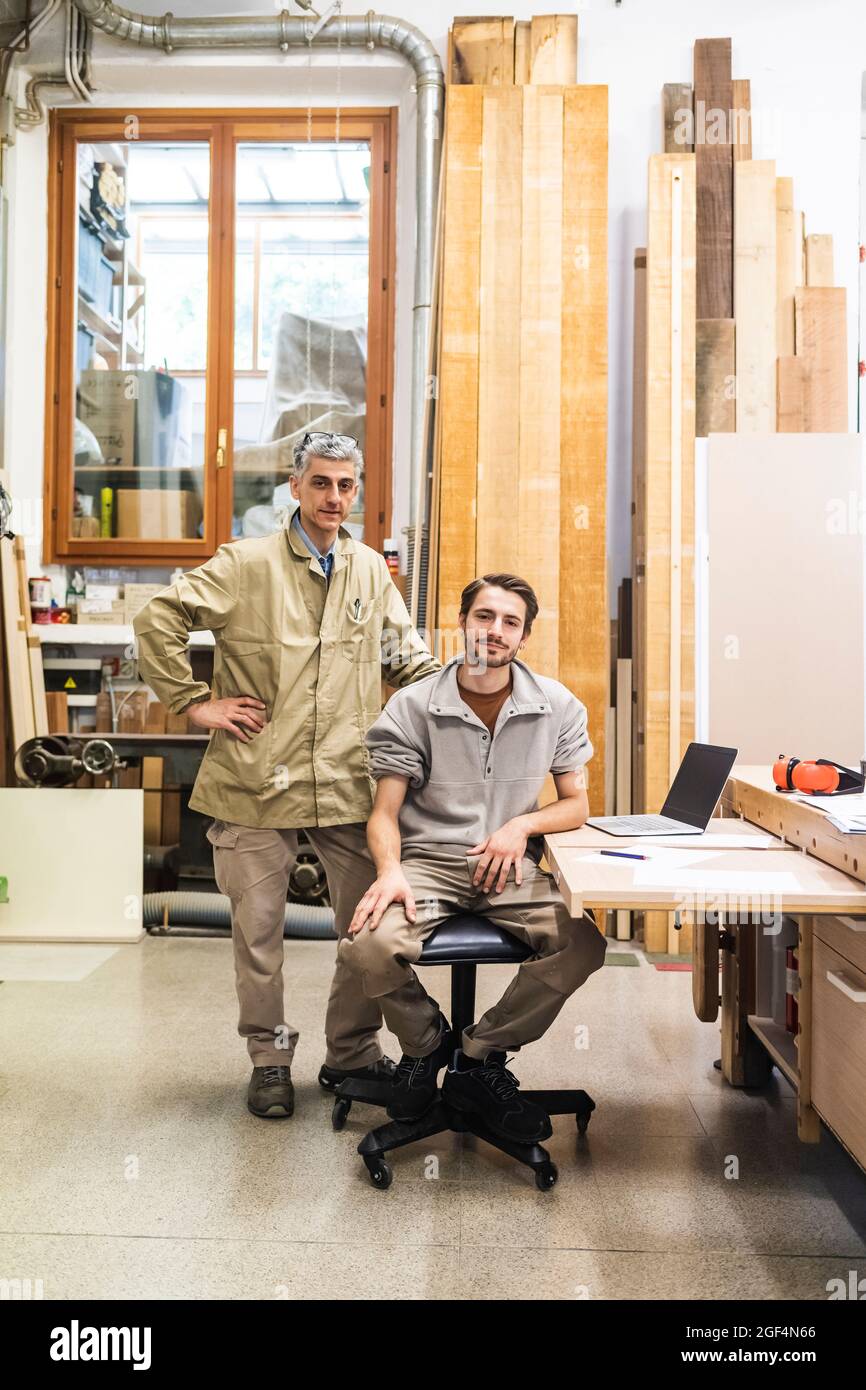 Male owner standing colleague hi-res stock photography and images - Alamy