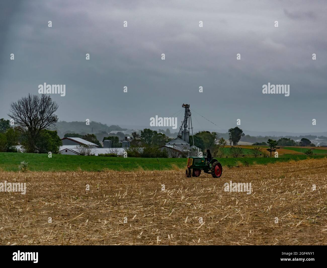 Old Antique Restored Farm Tracker With a Person on it Sitting in a ...