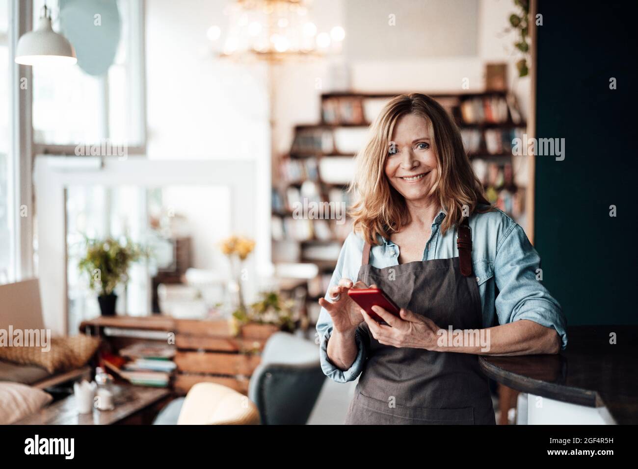 Female coffee shop owner standing hi-res stock photography and images ...