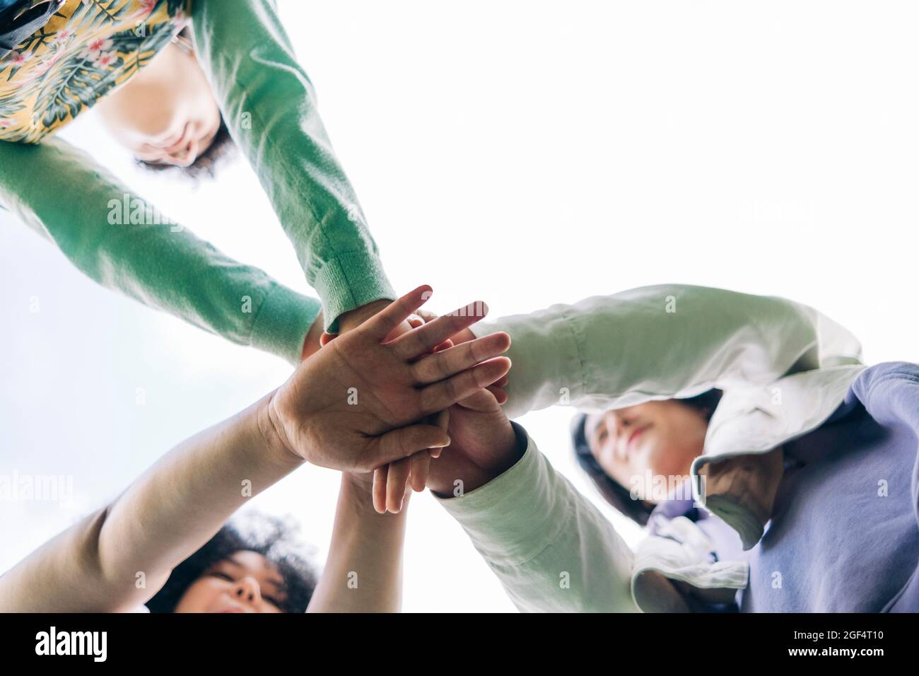 Multi ethnic hands stacked hi-res stock photography and images - Alamy