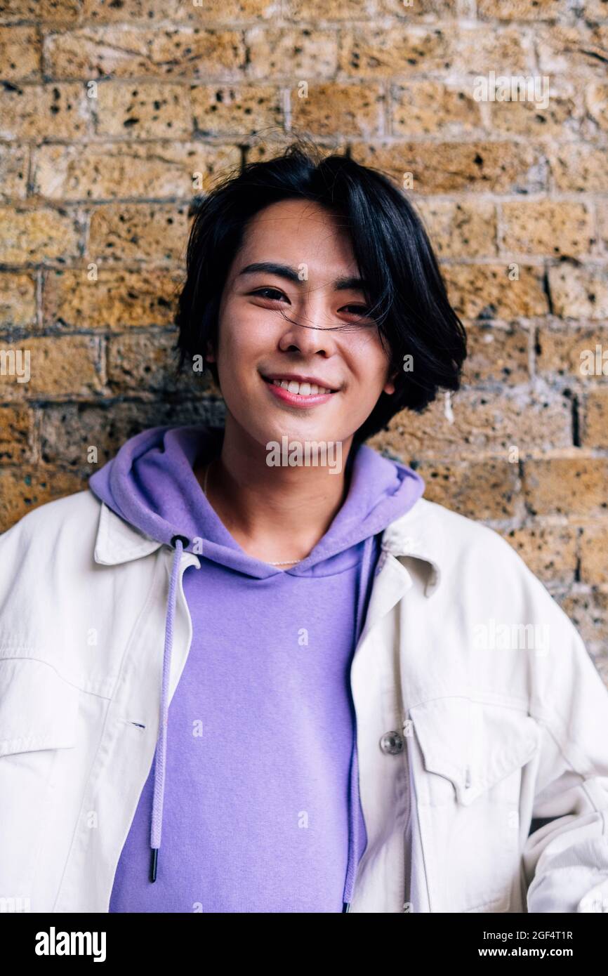 Young man with hooded jacket hi-res stock photography and images - Alamy