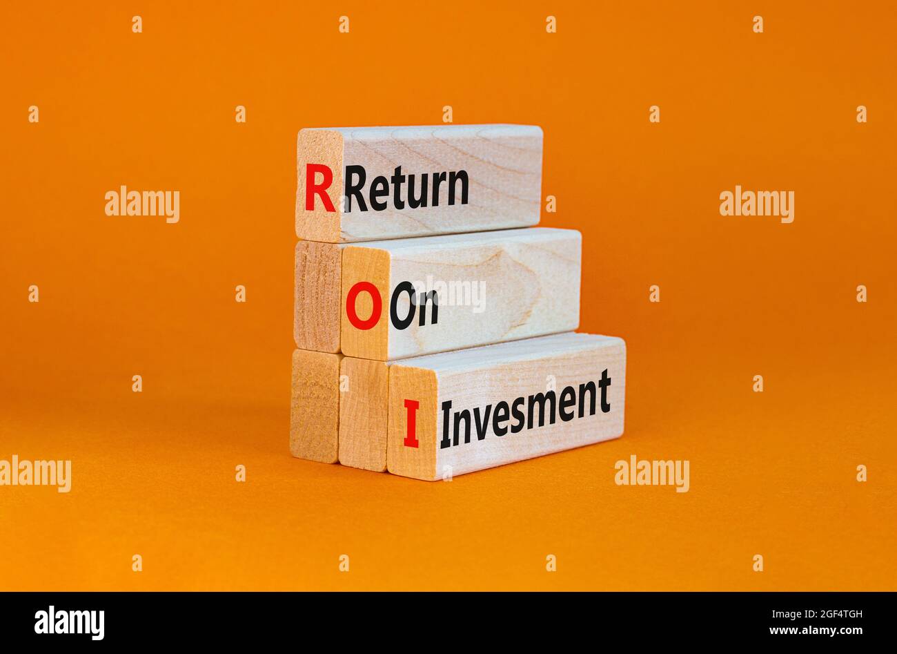 ROI, Return on investment symbol. Wooden blocks with words 'ROI, Return ...